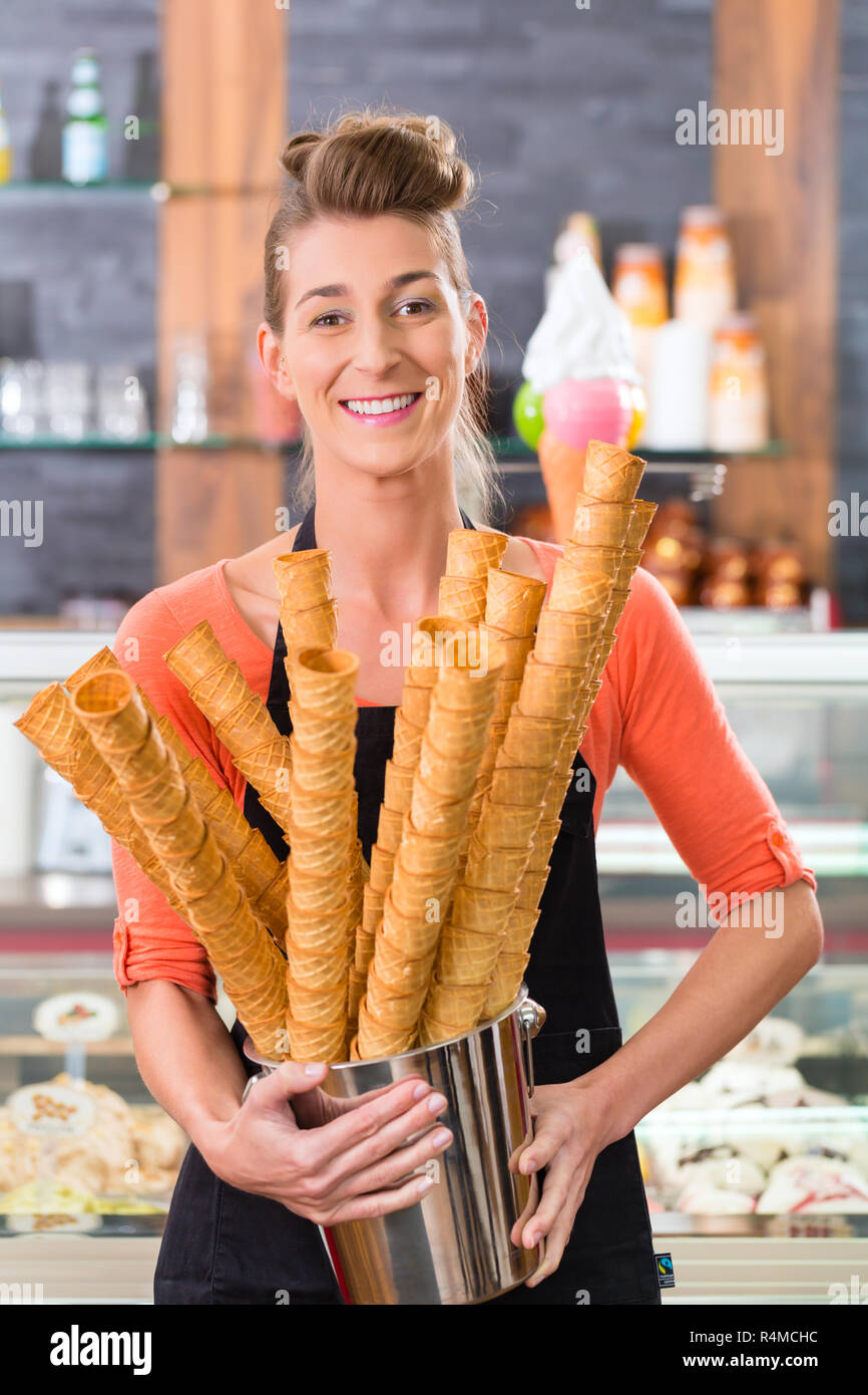 Female seller in Parlor with ice cream cone Stock Photo - Alamy