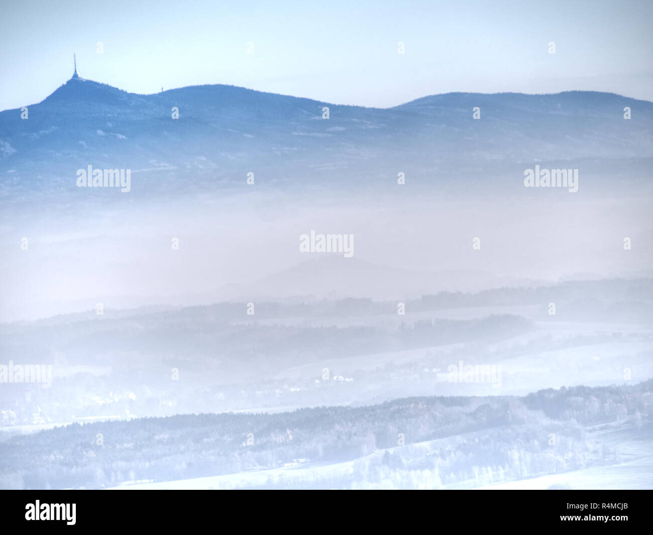 Blue mist above rounded hills in Landscape. Outline of real landscape ...