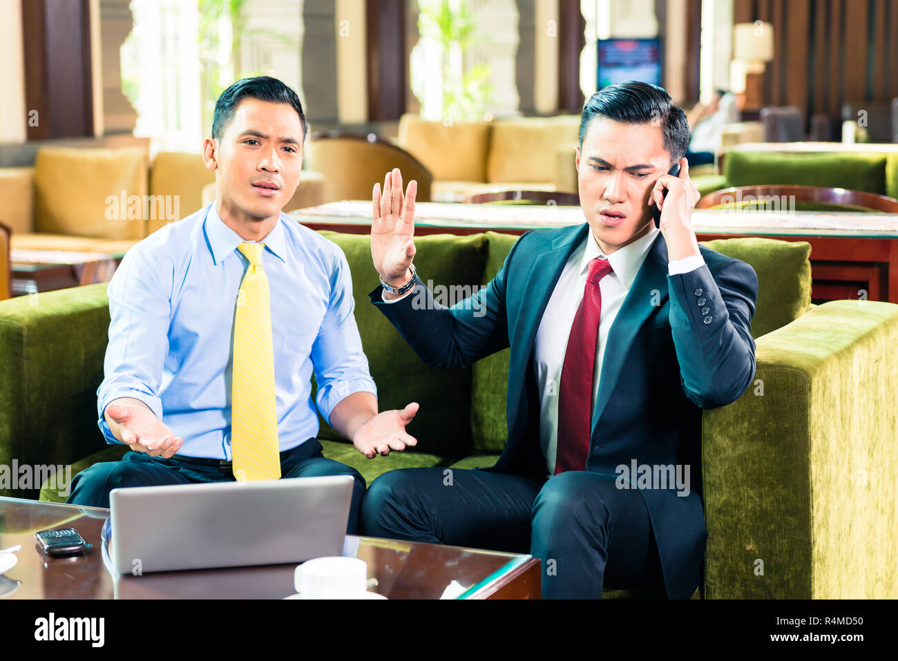 Asian Businessmen having meeting Stock Photo - Alamy