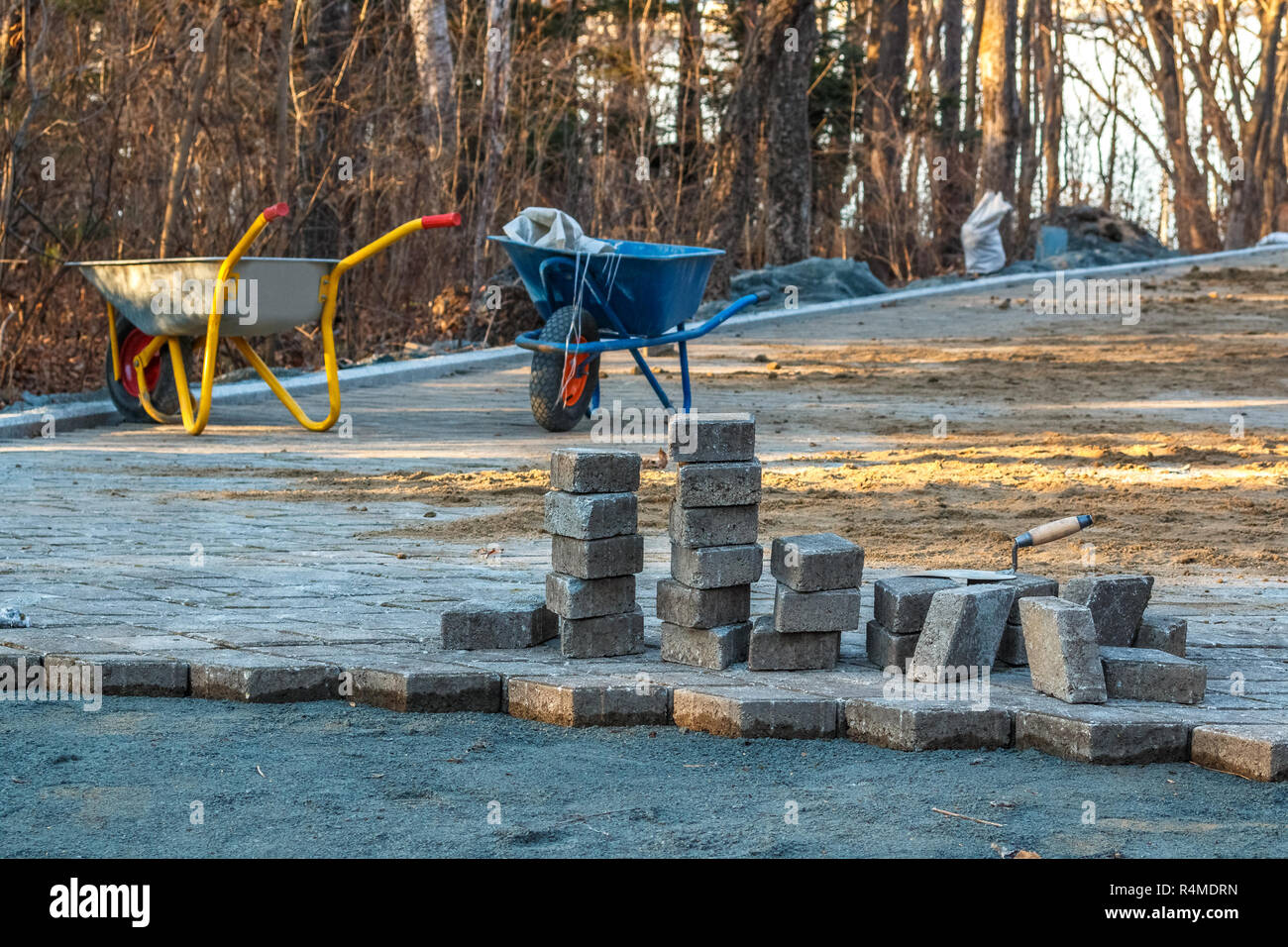 Construction site and paving on a walking path in a public park. Scene ...