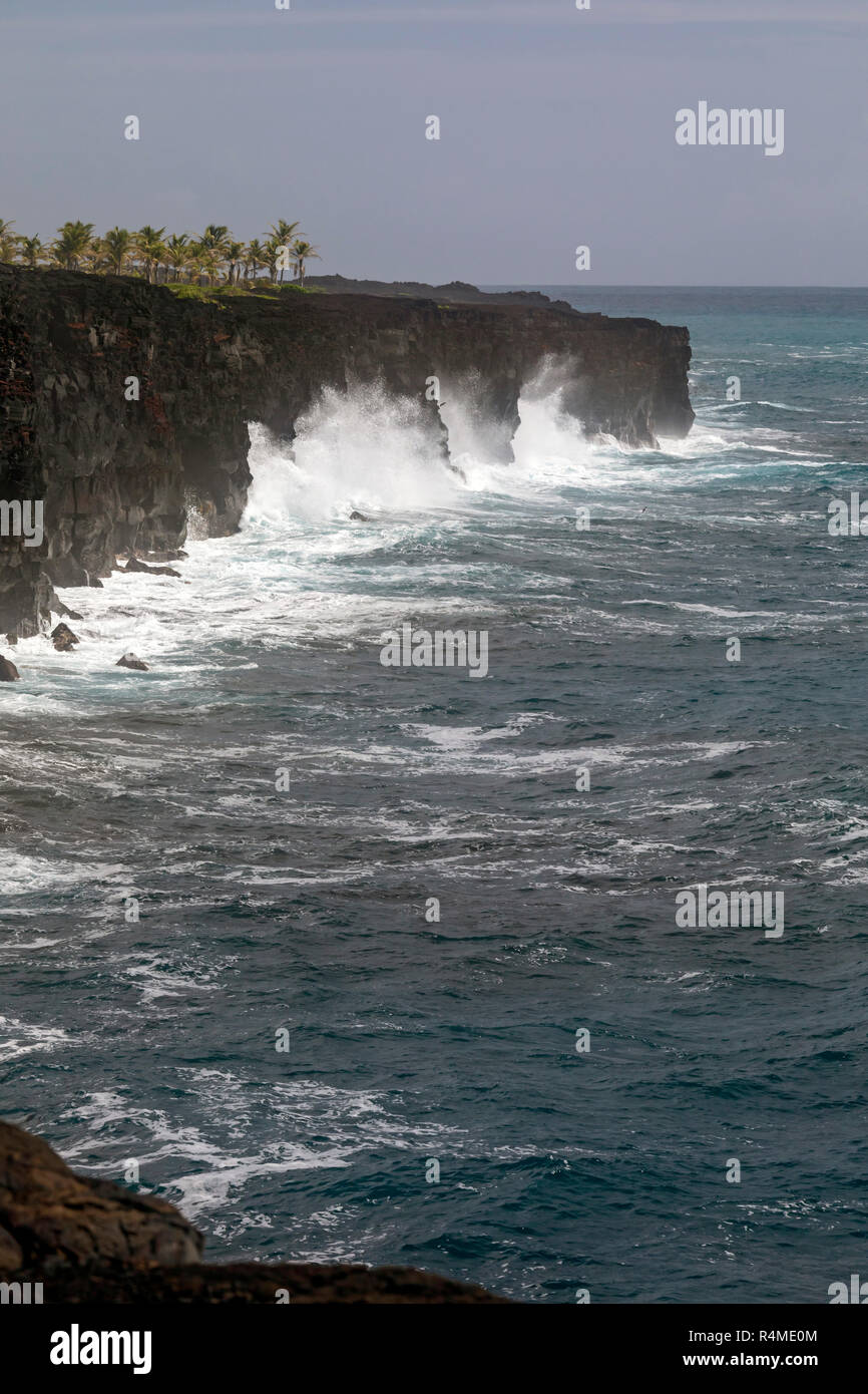 Hawaii Volcanoes National Park, Hawaii - Waves crash against cliffs ...
