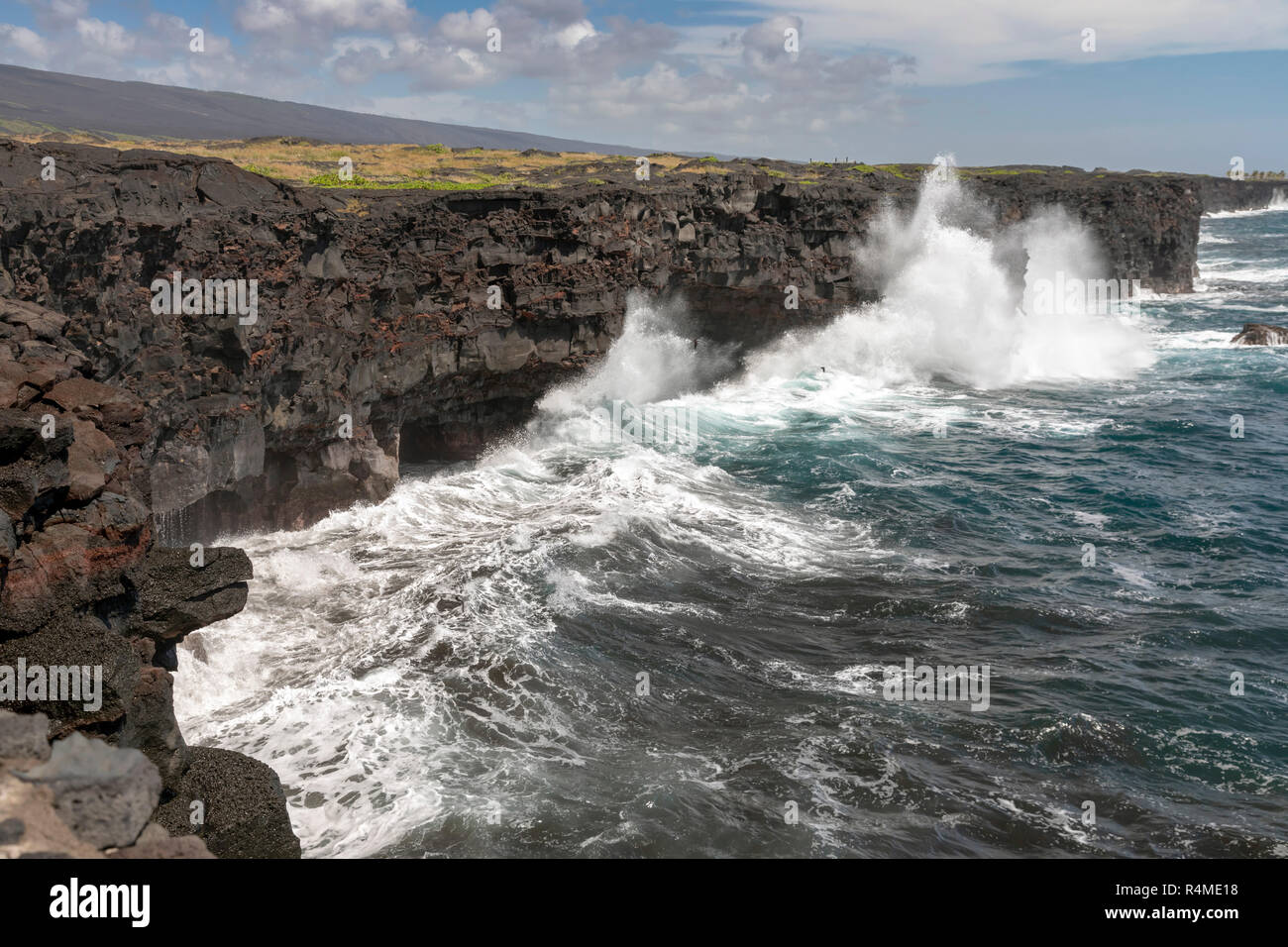 Hawaii Volcanoes National Park, Hawaii - Waves crash against cliffs ...