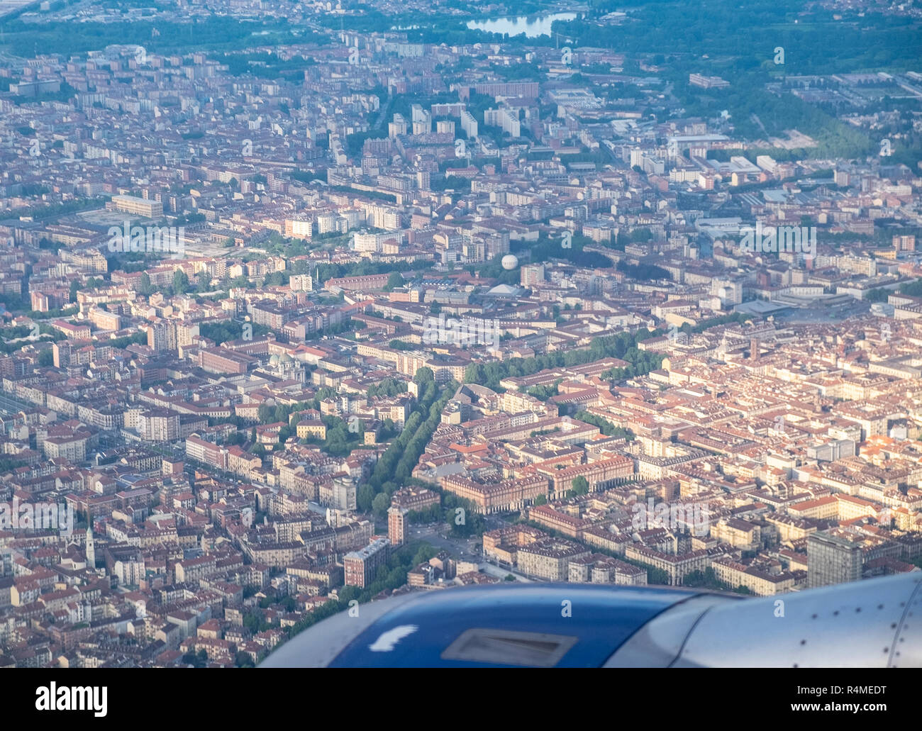 Plane landing in Turin, Italy, with city view below Stock Photo - Alamy