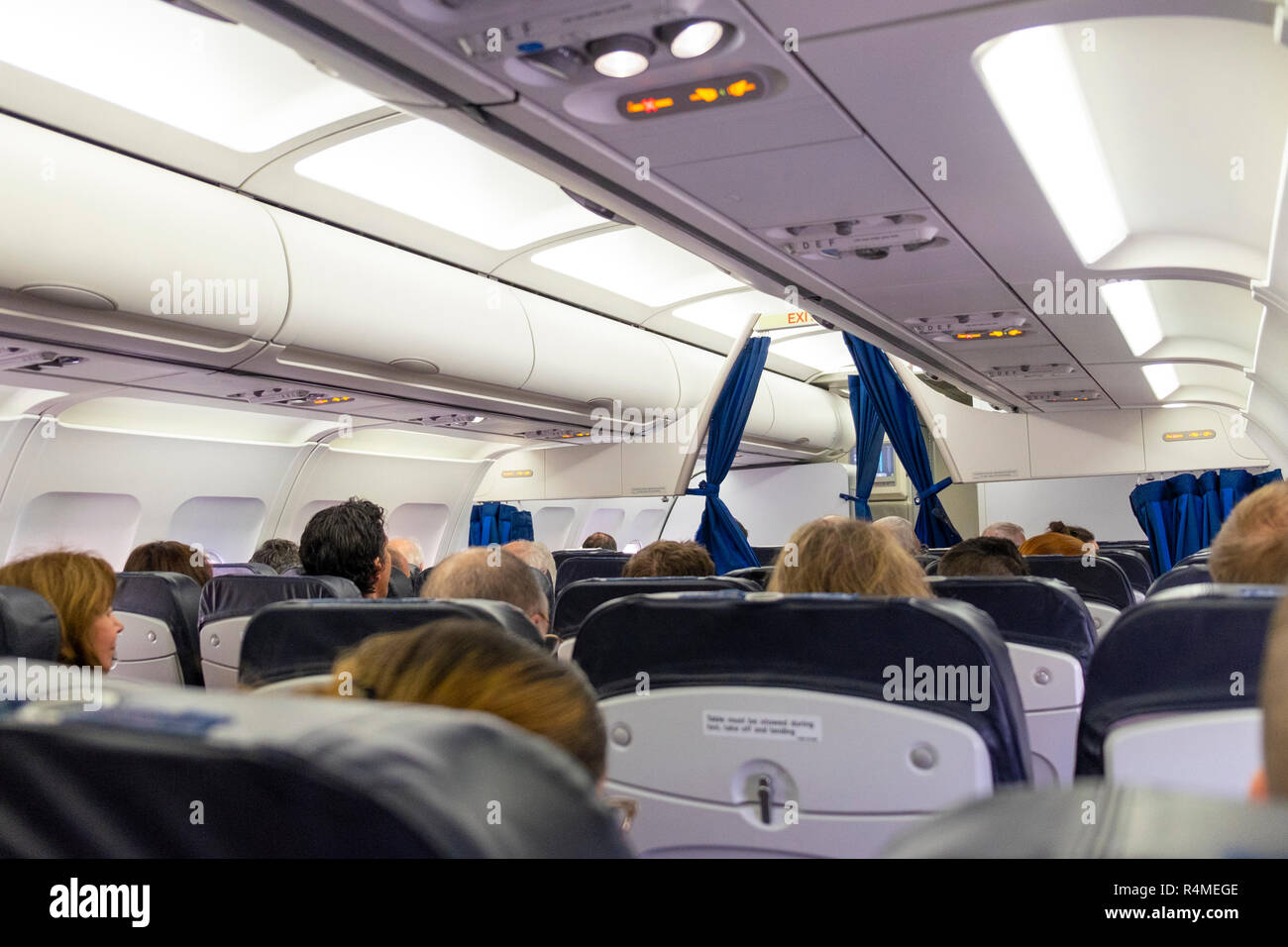 Airplane Passengers Full Flight High Resolution Stock Photography and ...