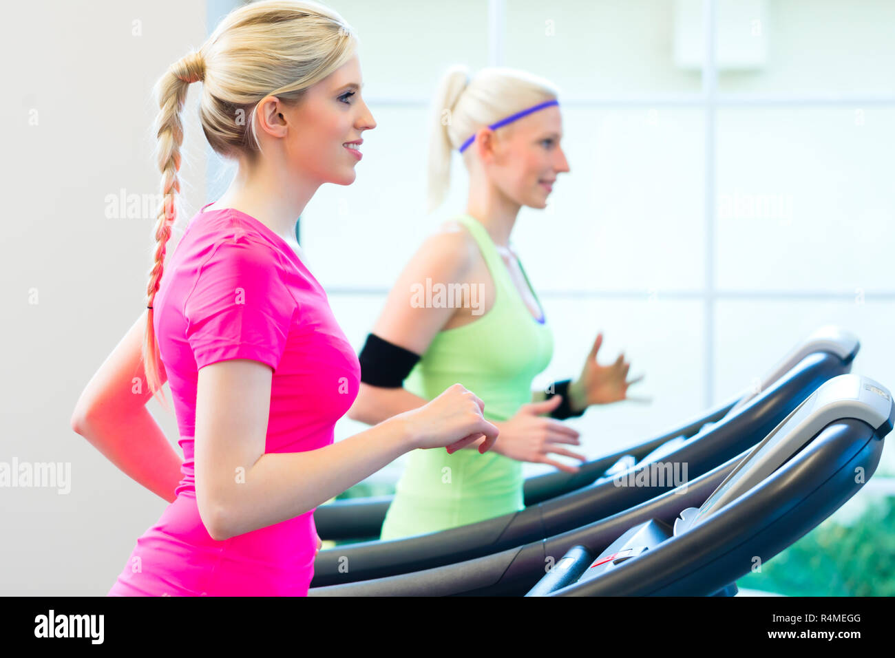 Young woman runs on treadmill hi-res stock photography and images - Alamy