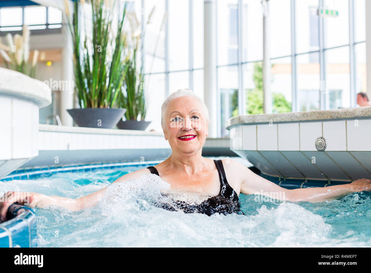 Senior woman relaxing in wellness spa Stock Photo - Alamy