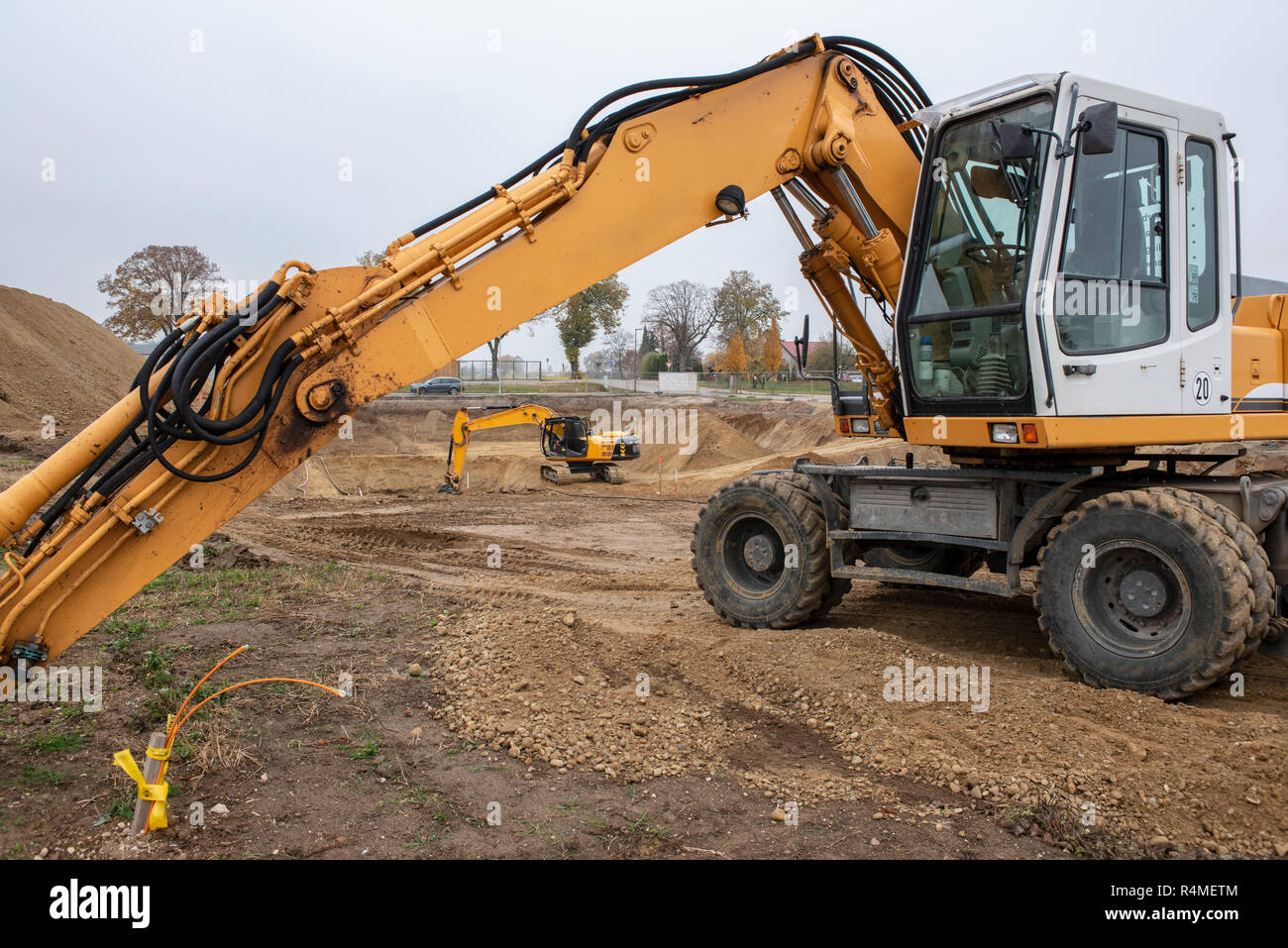 digger and truck working in excavation pit Stock Photo - Alamy
