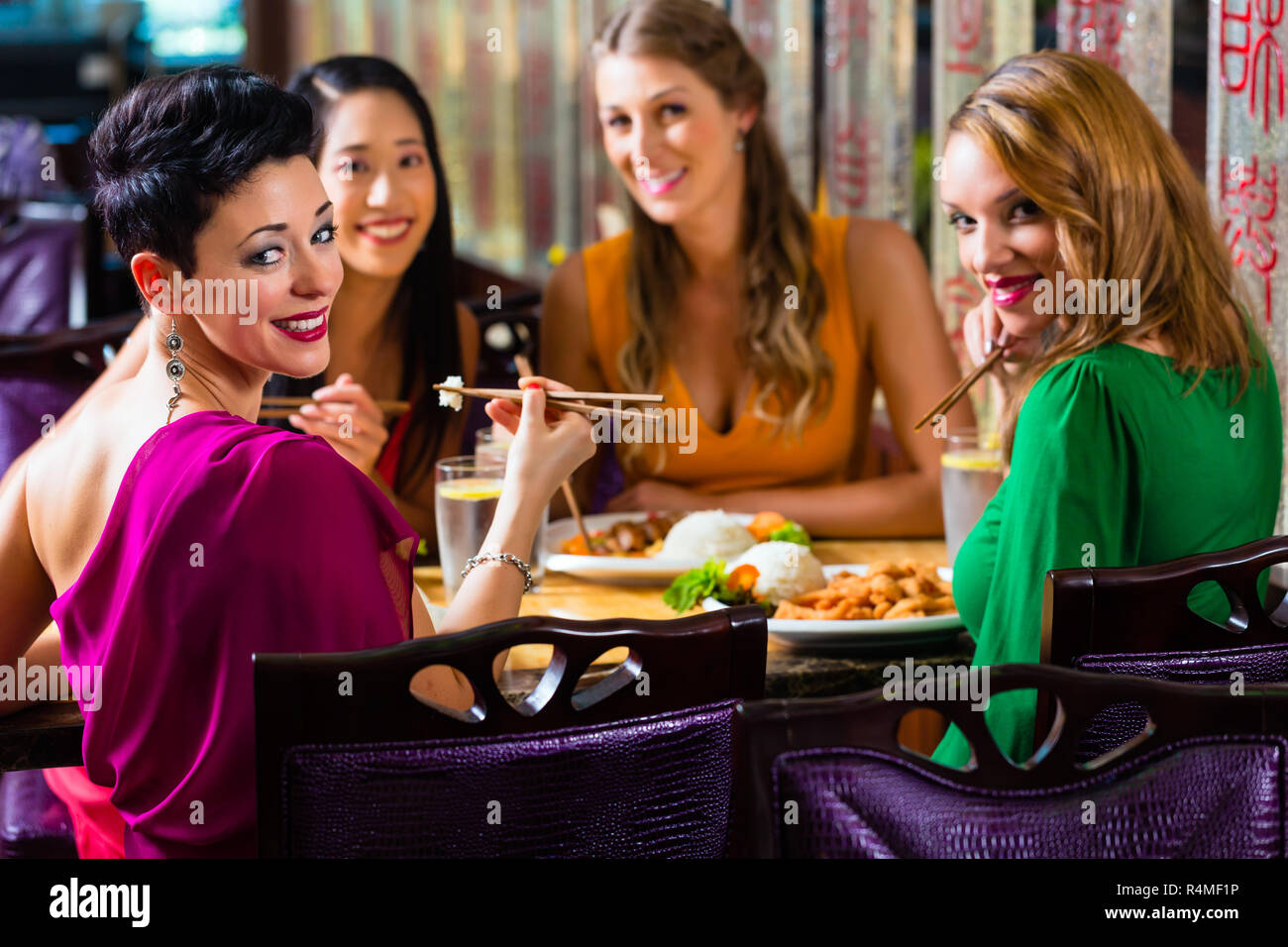 Young people eating in Asia restaurant Stock Photo - Alamy