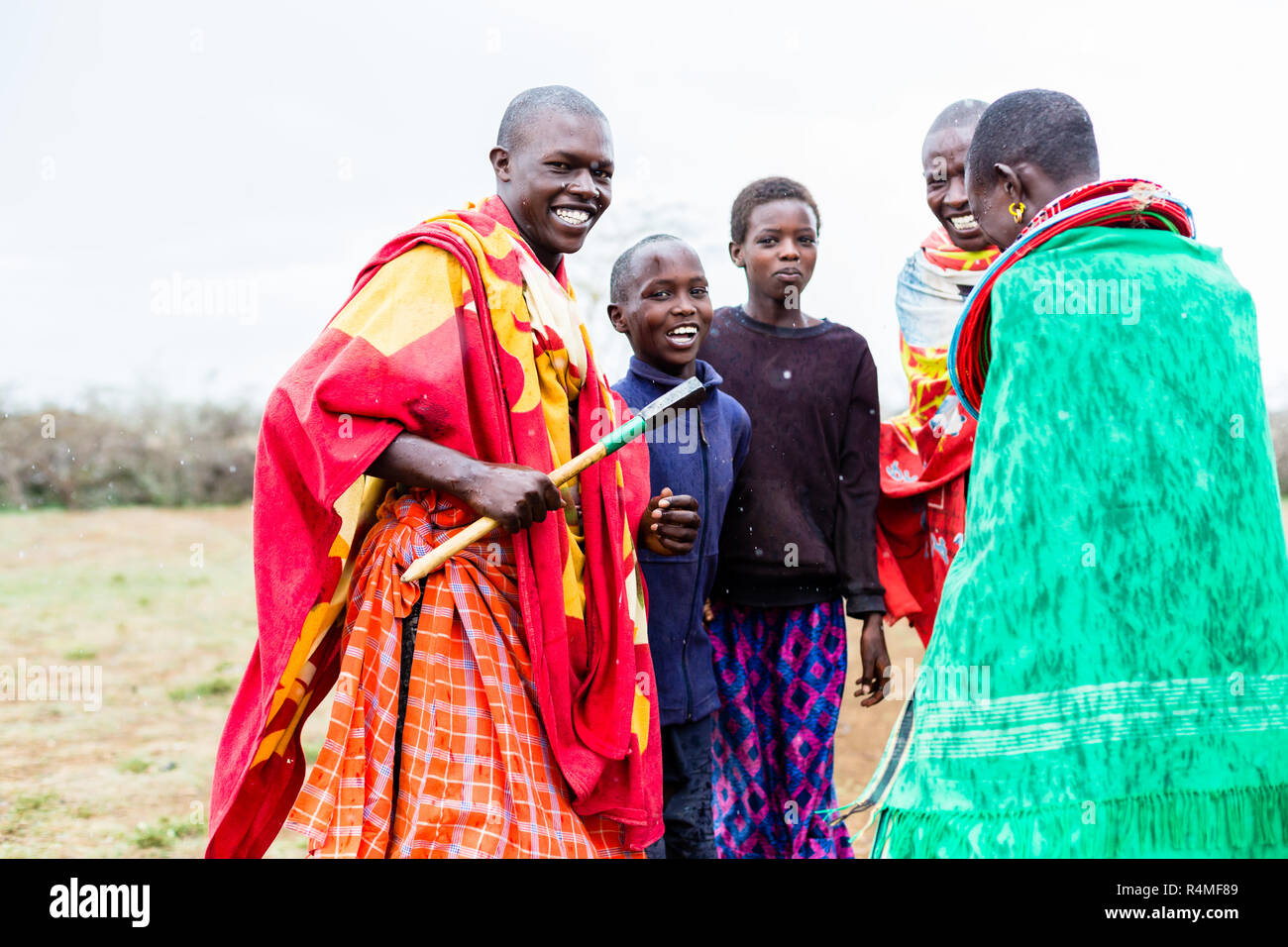 Massai family celebrating and dancing Stock Photo - Alamy