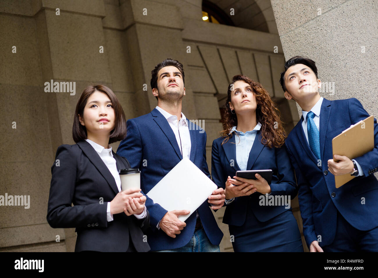 Business people looking up Stock Photo - Alamy
