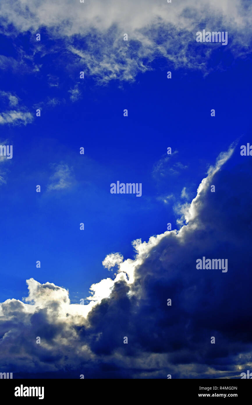 Rain filled cumulus nimbus clouds and blue sky Stock Photo - Alamy