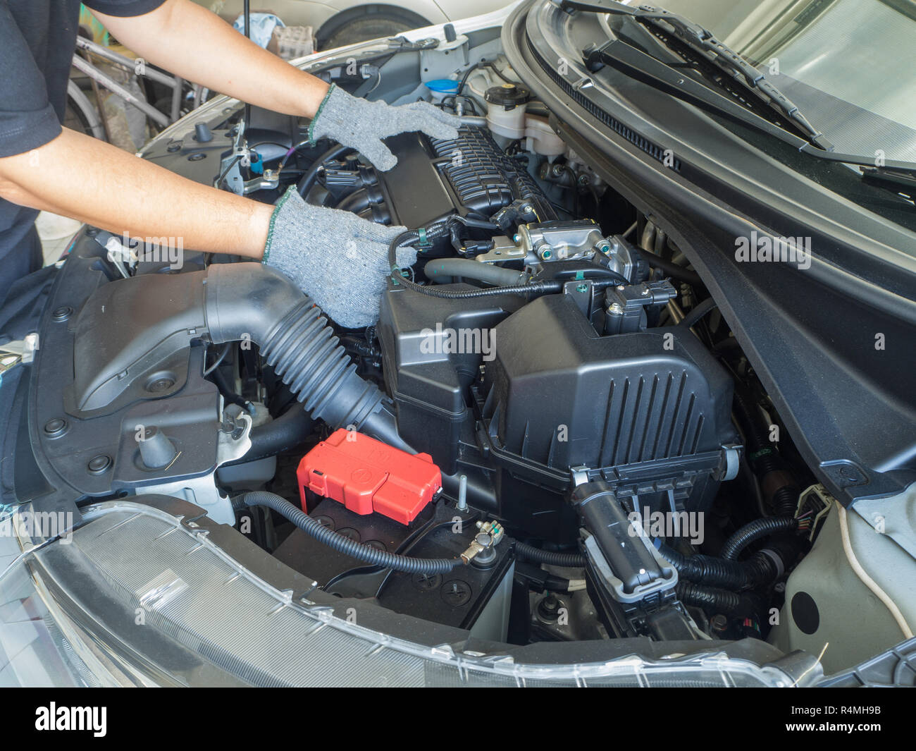 Car mechanic working in auto repair service Stock Photo - Alamy