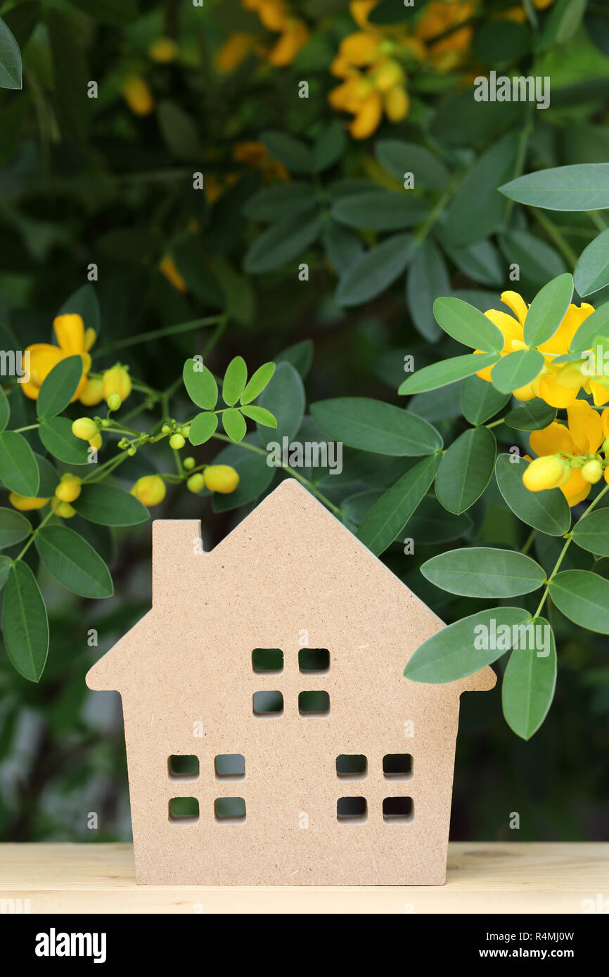 wooden toy house with beautiful blossom tree in background Stock Photo ...