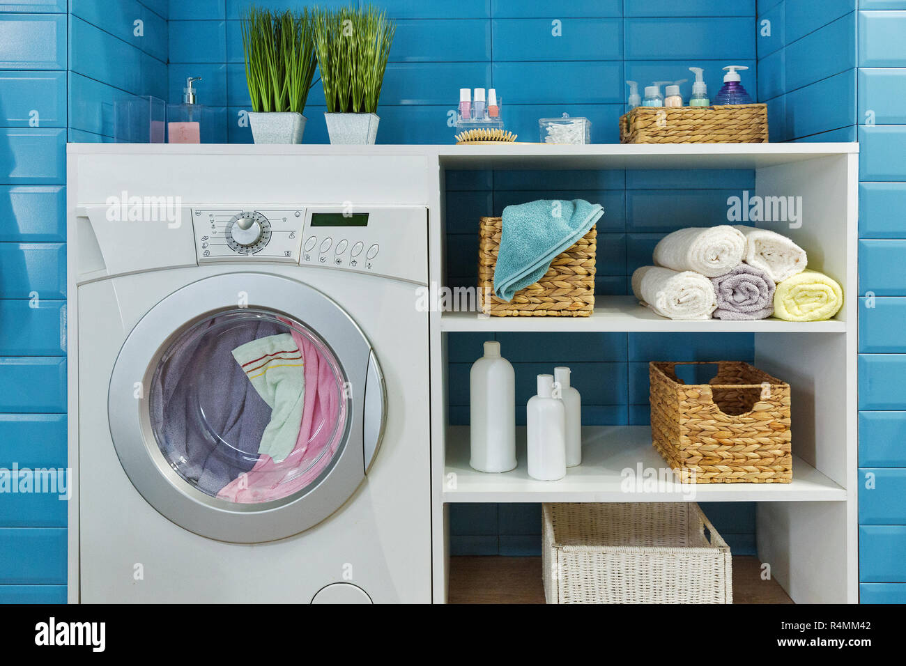 modern bathroom with white washing machine and blue tile Stock Photo ...
