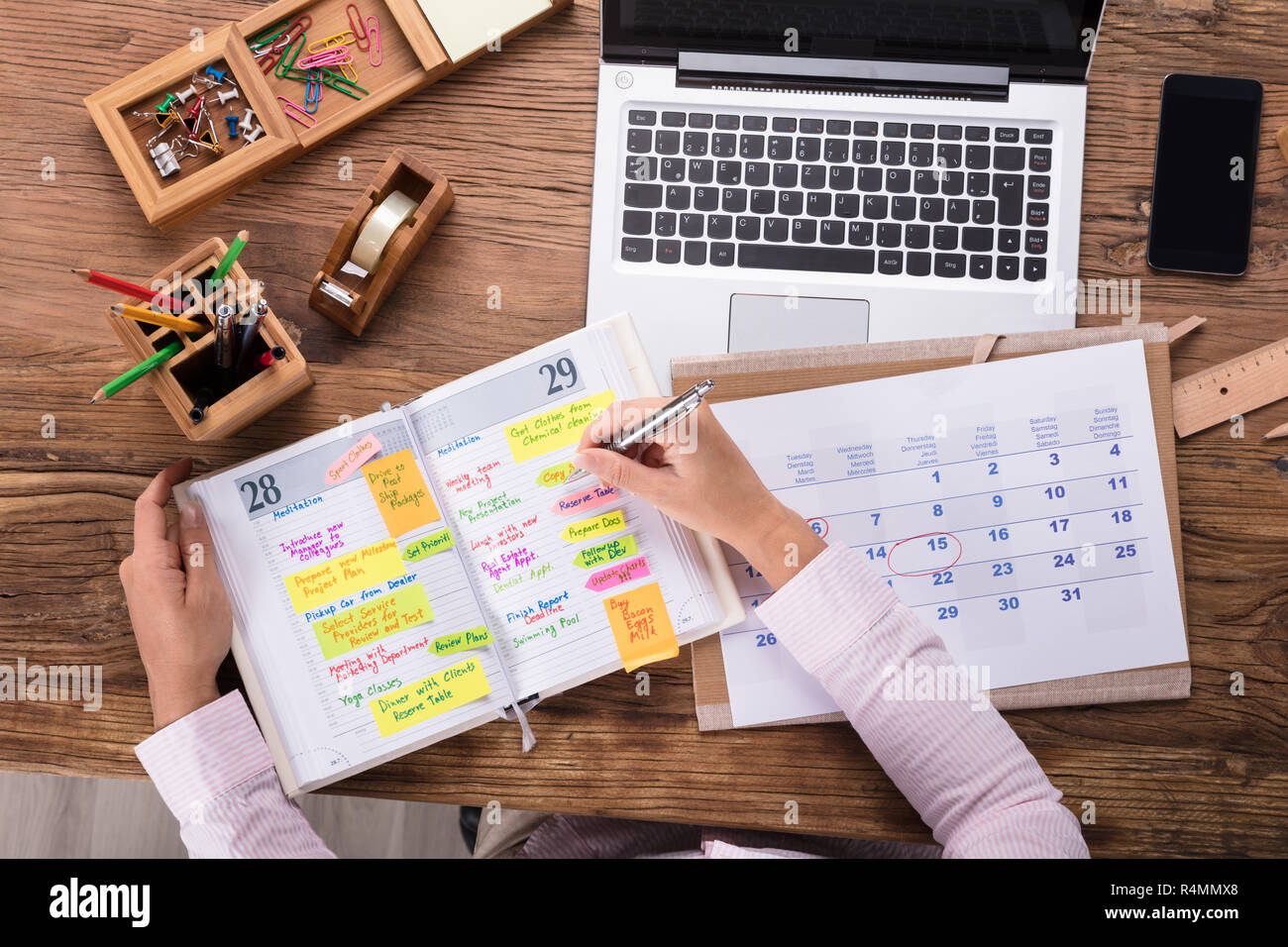 Woman writes in calendar hi-res stock photography and images - Alamy