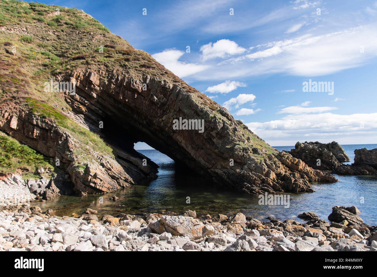 Bow Fiddle Rock is a natural sea arch near Portknockie on the north ...