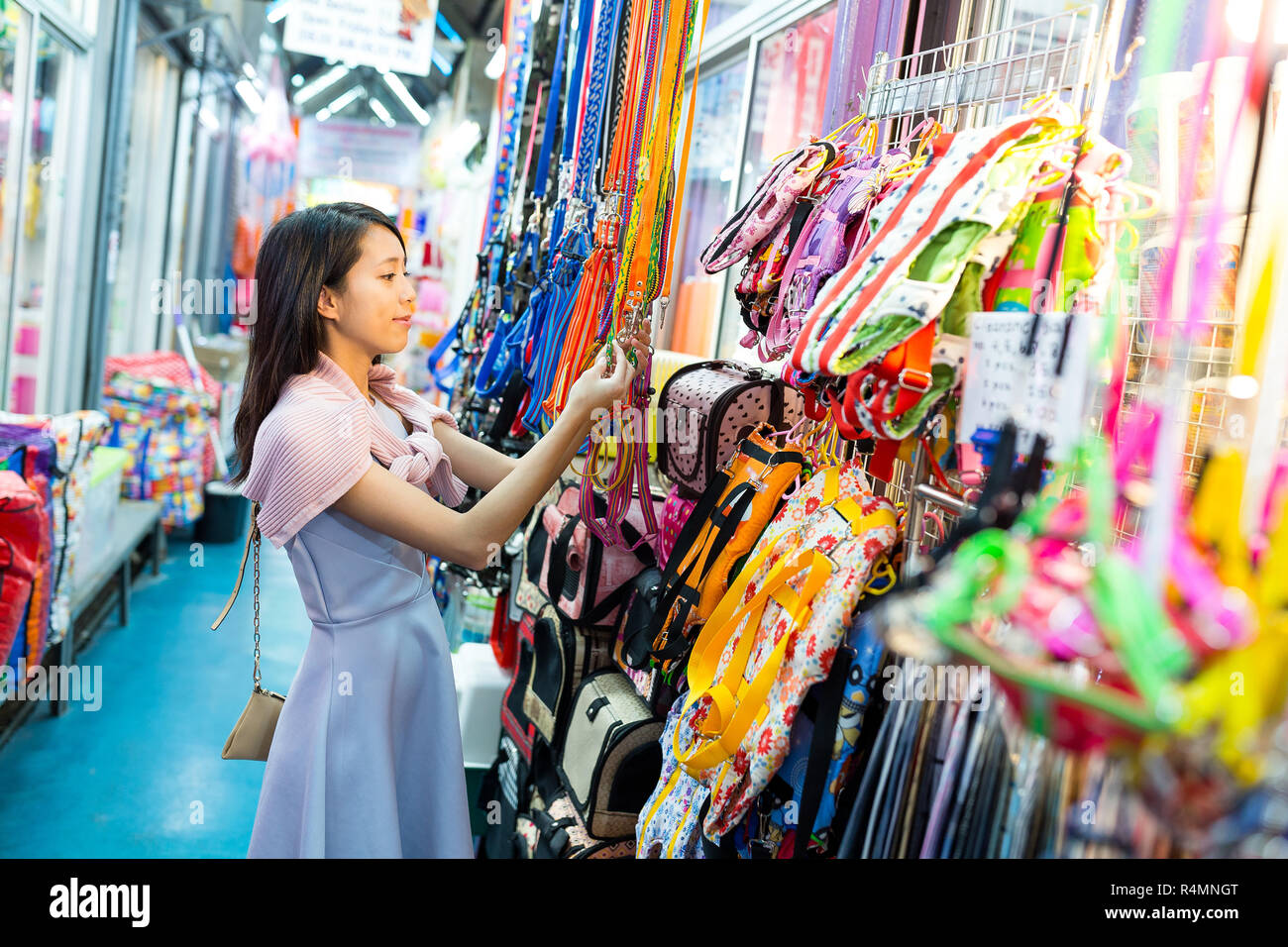 Woman picking something in shop Stock Photo - Alamy