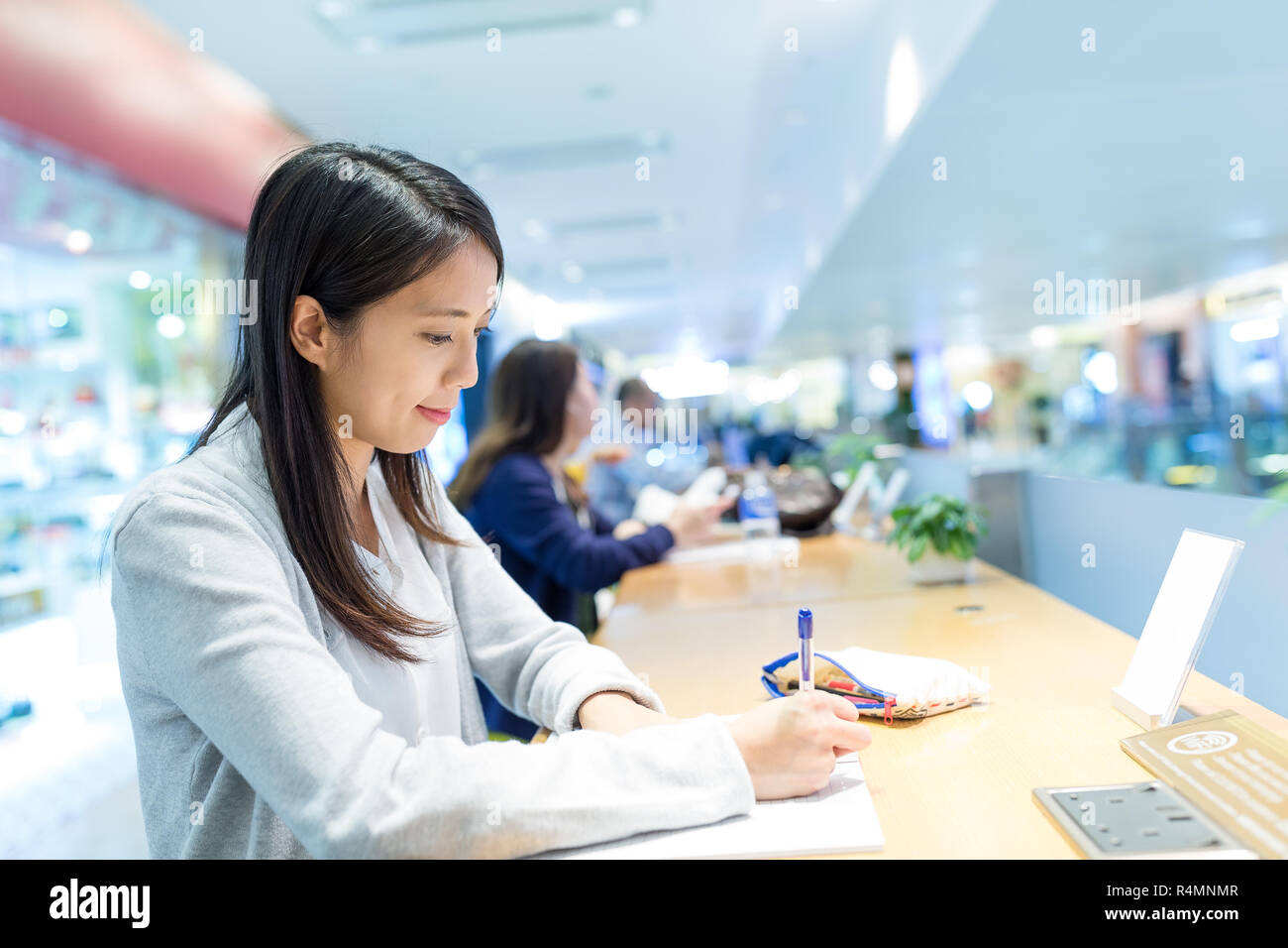 Woman taking note and study at coffee shop Stock Photo - Alamy