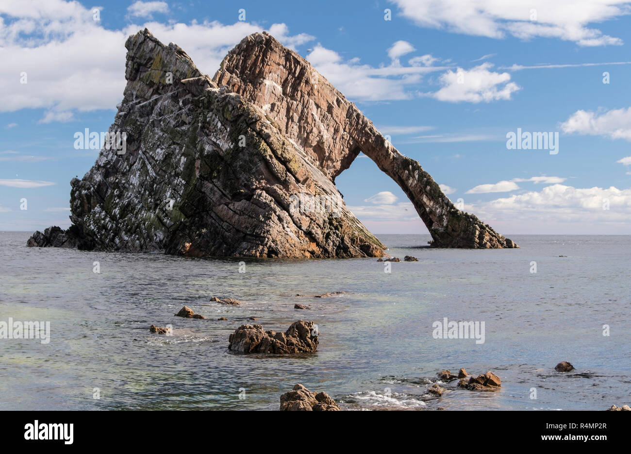 Bow Fiddle Rock is a natural sea arch near Portknockie on the north ...