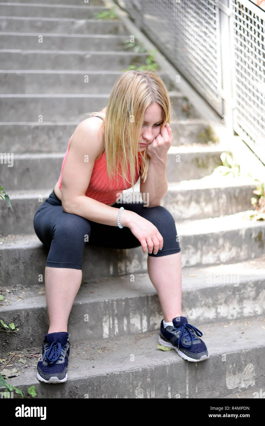exhausted young woman Stock Photo - Alamy
