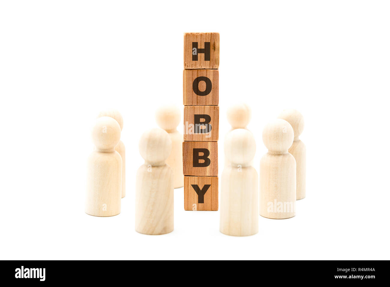 Wooden figures as business team in circle around word HOBBY, isolated ...
