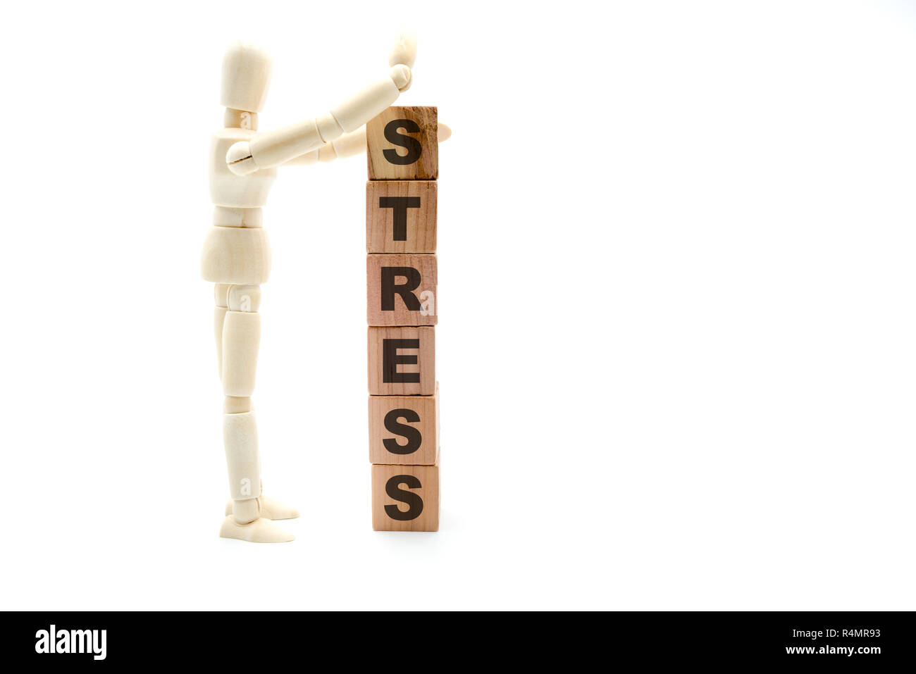 Wooden figure as businessman building Stress concept as tower of wood ...