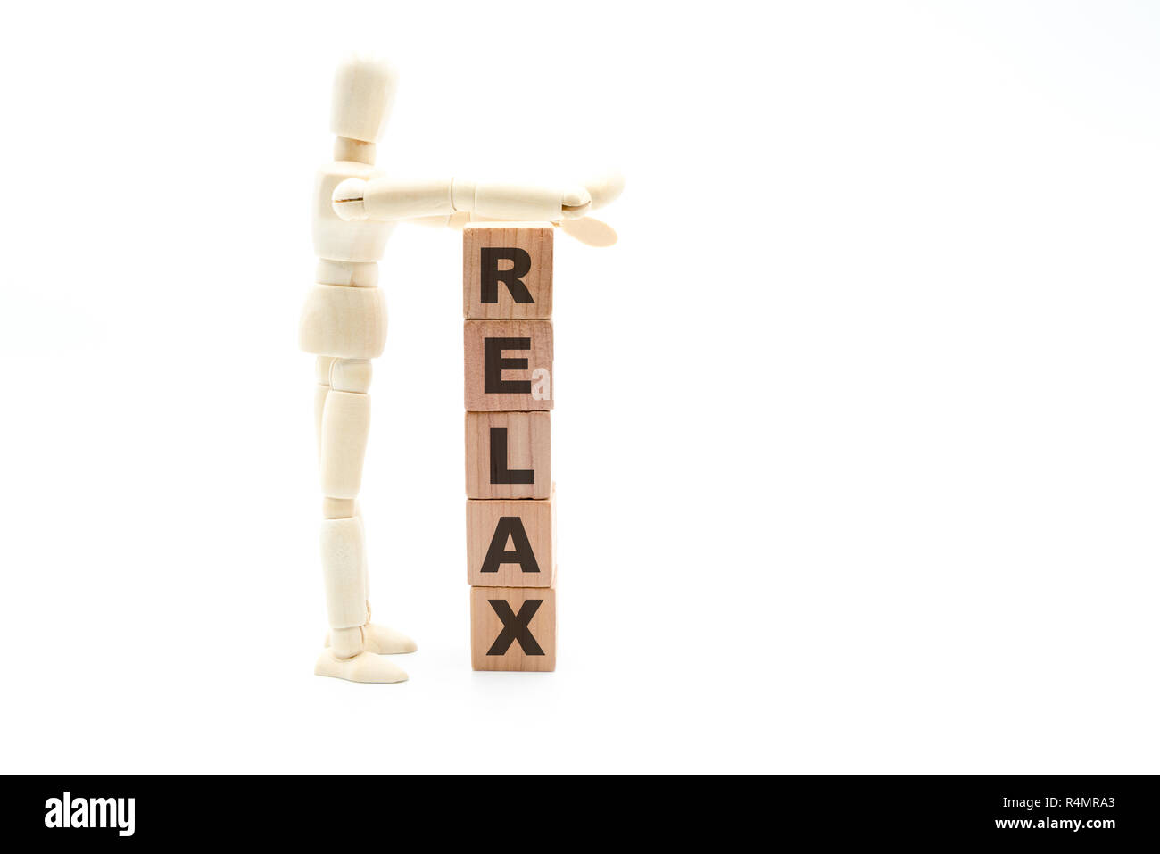 Wooden figure as businessman building Relax concept as tower of wood ...