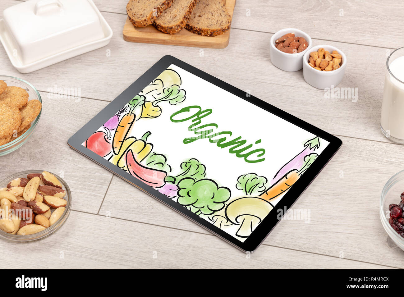 Healthy food composition with tablet Stock Photo - Alamy