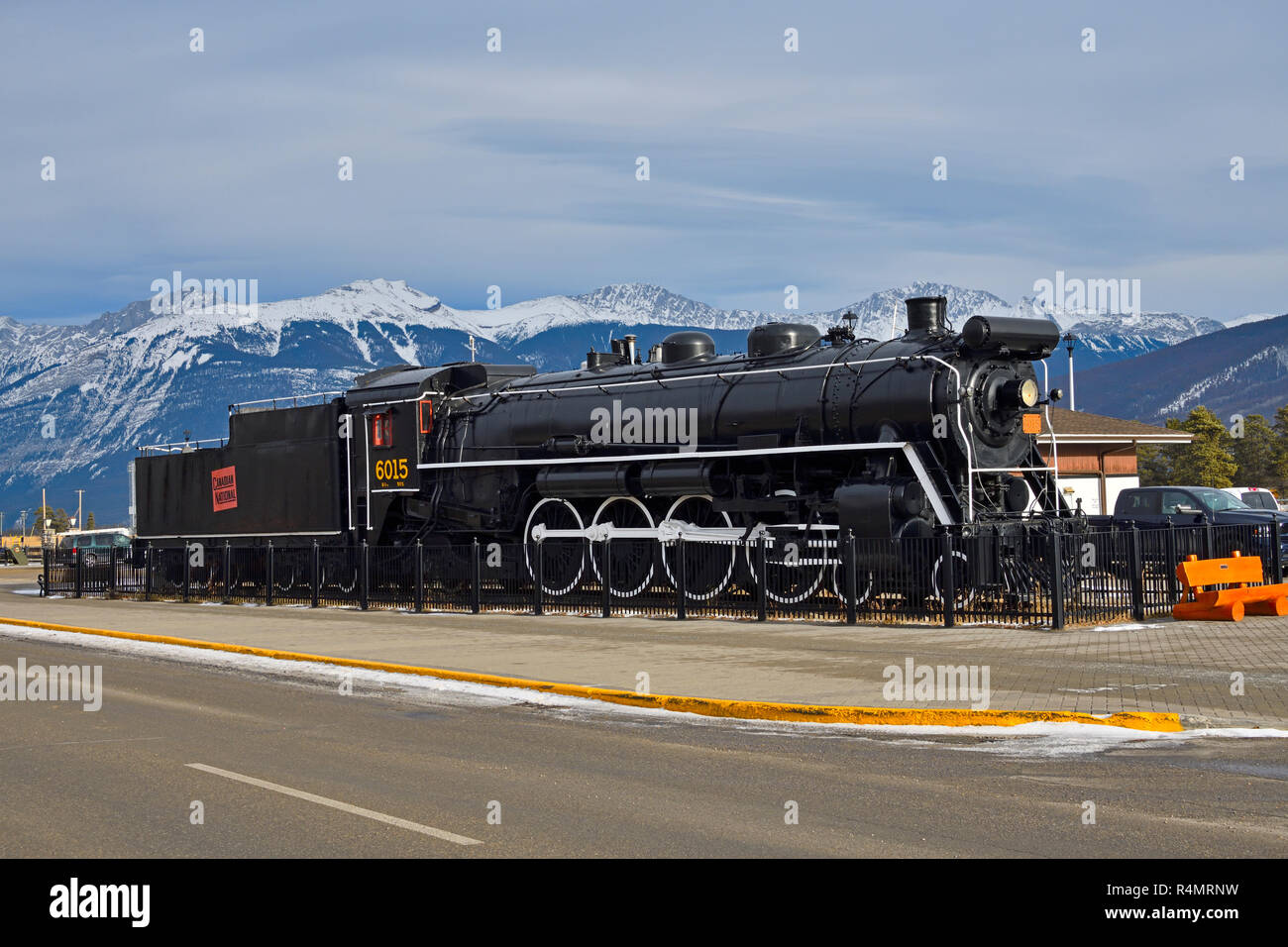 A horizontal image of the steam train parked in the town of Jasper as a ...