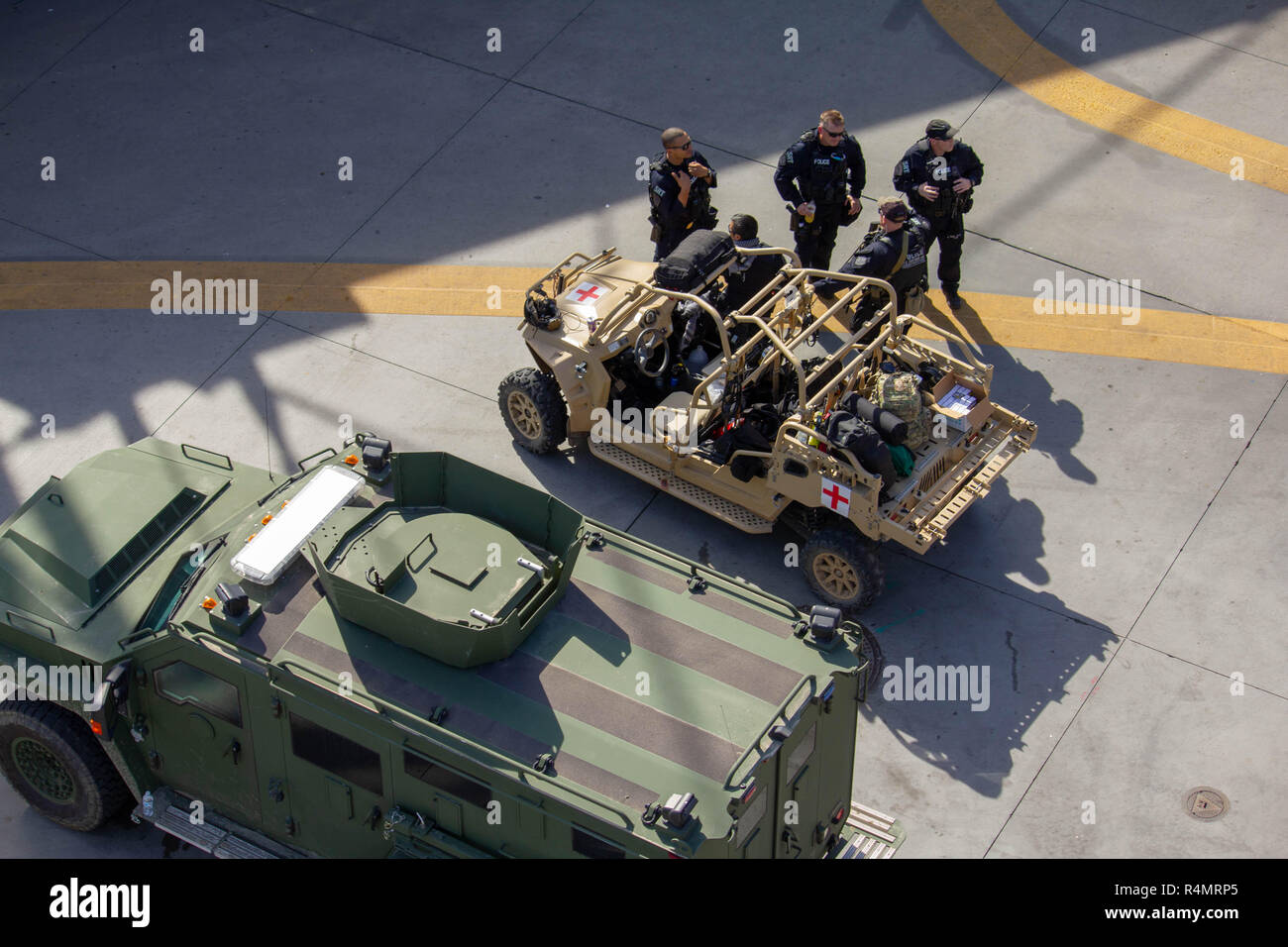 U.S. Customs and Border Patrol agents in riot gear shut the border into ...