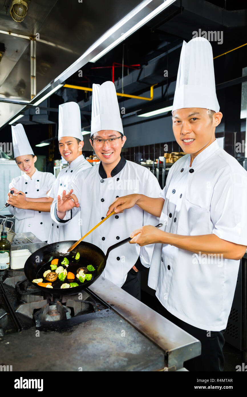 Asian Chefs in restaurant kitchen cooking Stock Photo - Alamy