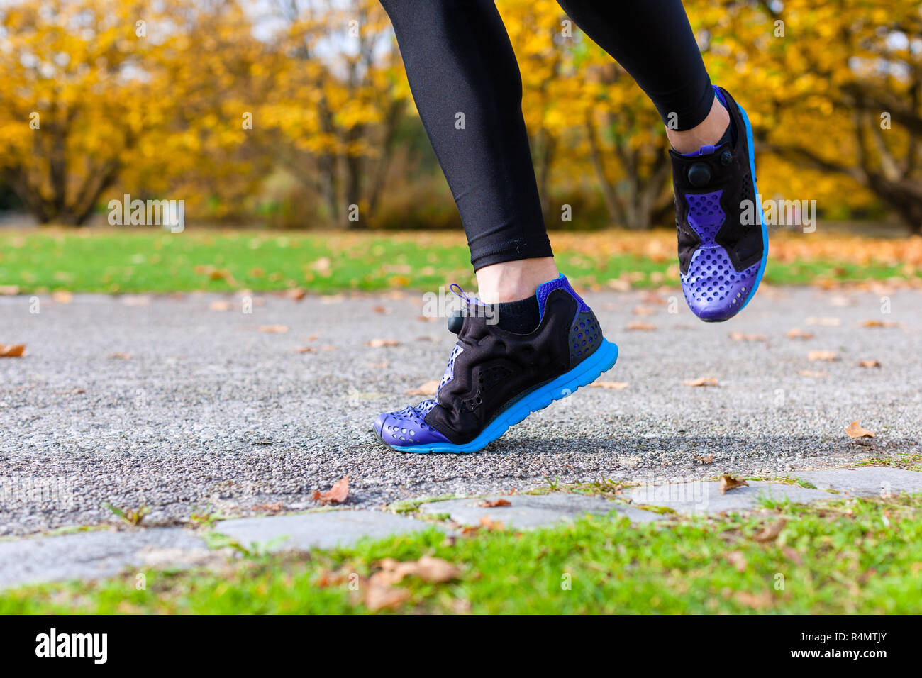 Fitness model runs through park hi-res stock photography and images - Alamy