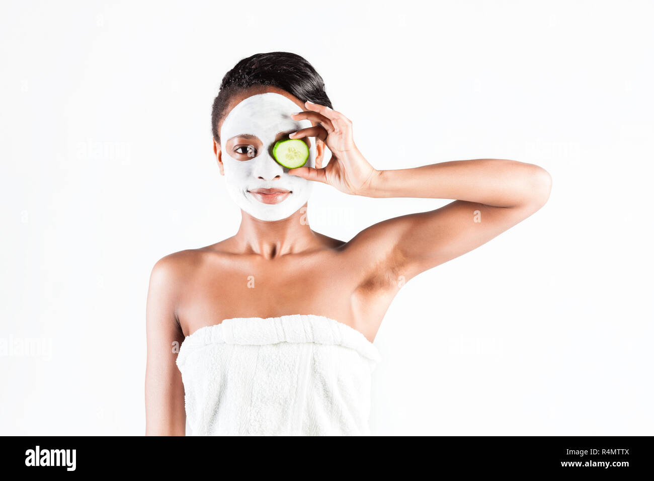 Beautiful African woman in Studio with facial mask Stock Photo - Alamy