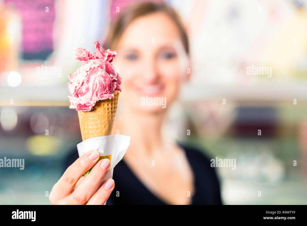 Ice-cream seller serving ice cream Stock Photo - Alamy