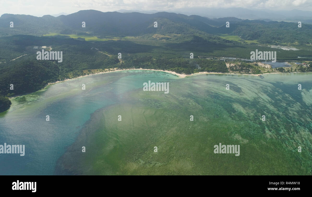 Aerial view of beautiful tropical beach with turquoise water in blue ...