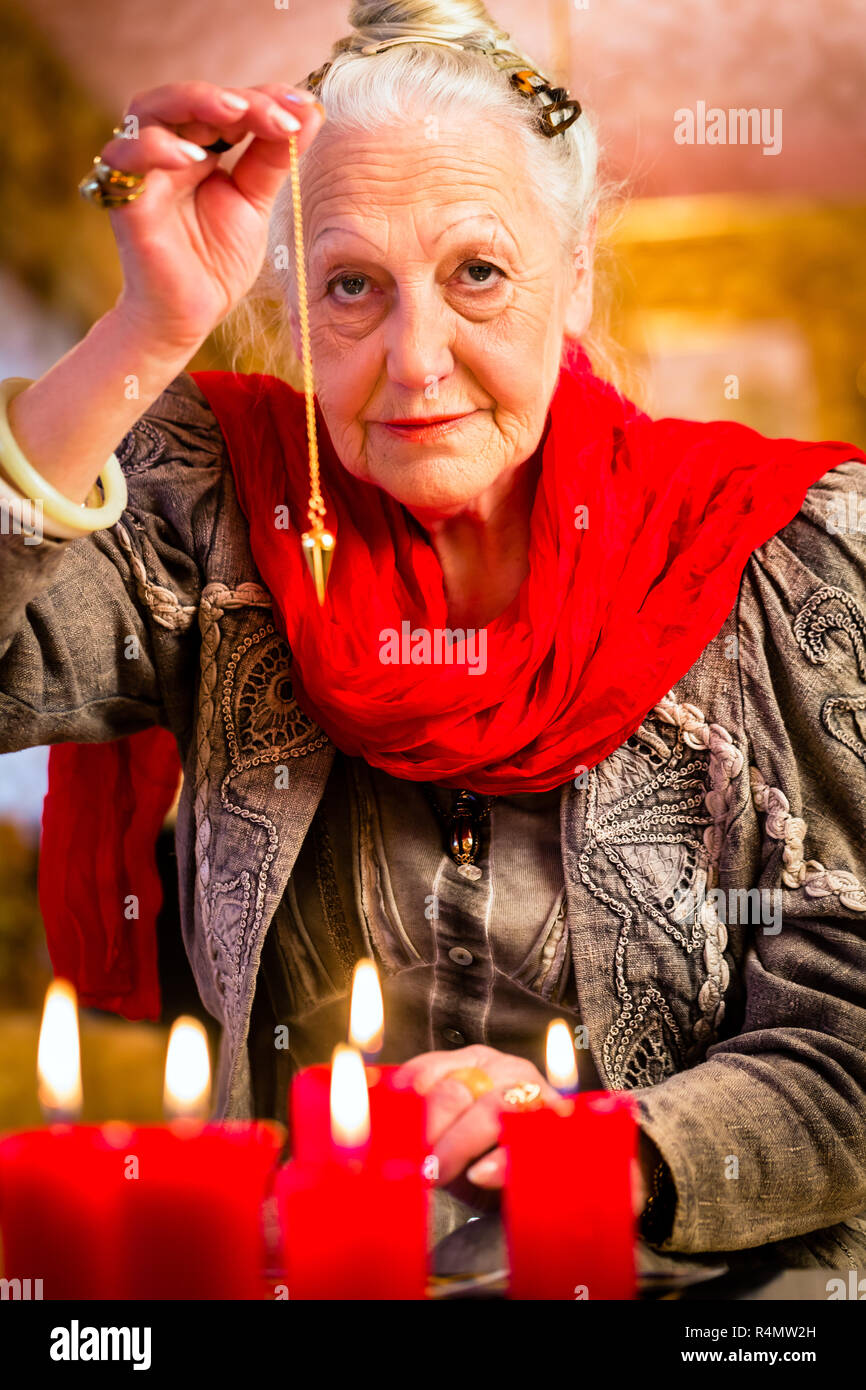 Pendulum dowsing woman hi-res stock photography and images - Alamy