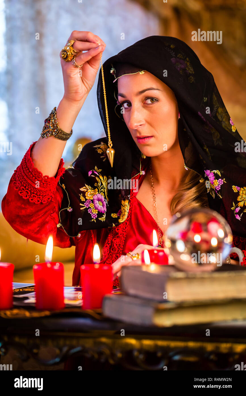 Woman pendulum dowsing hi-res stock photography and images - Alamy