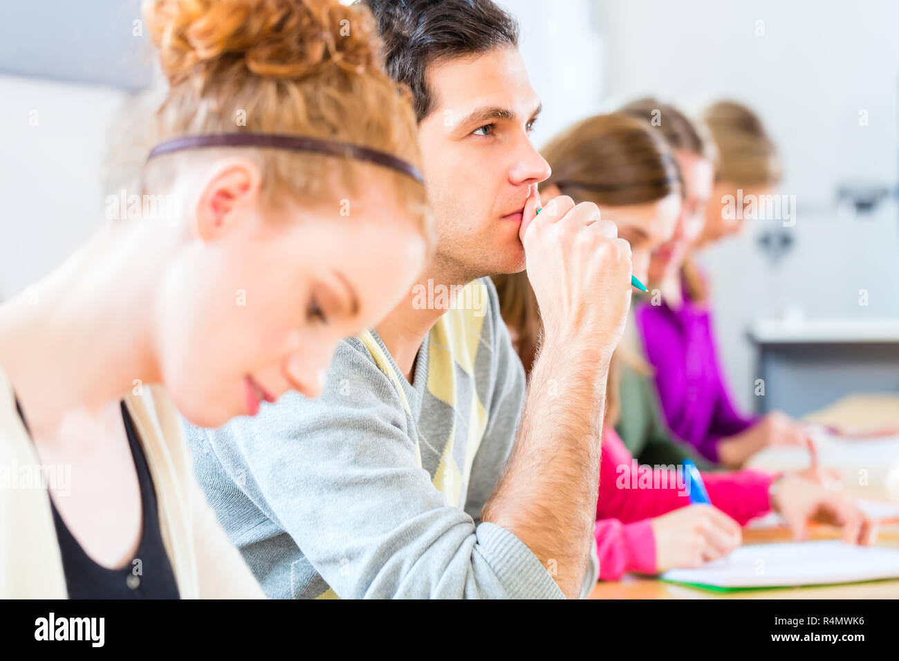 College students writing test Stock Photo - Alamy