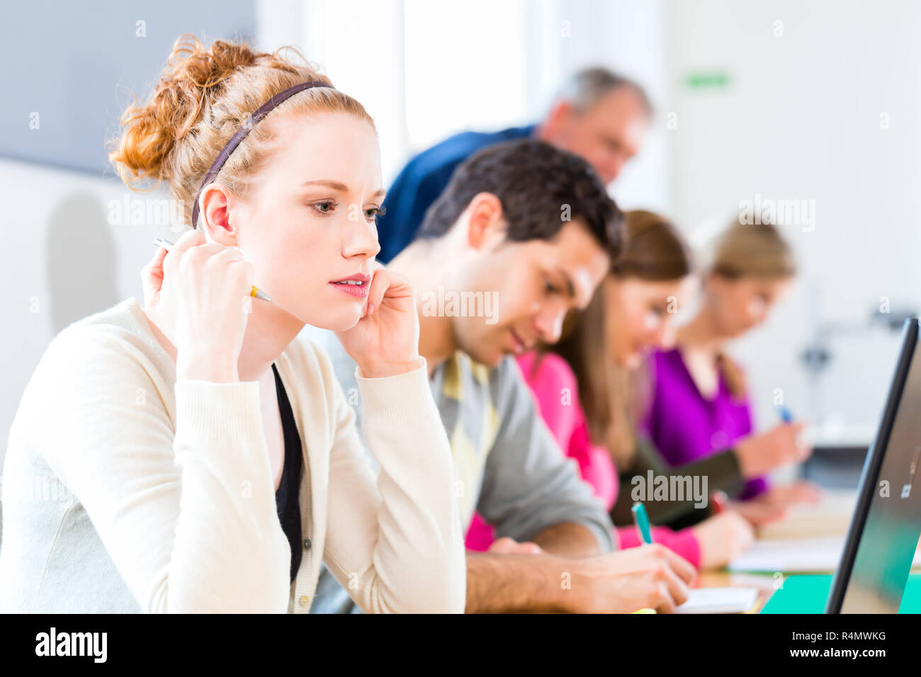 College students writing test Stock Photo - Alamy