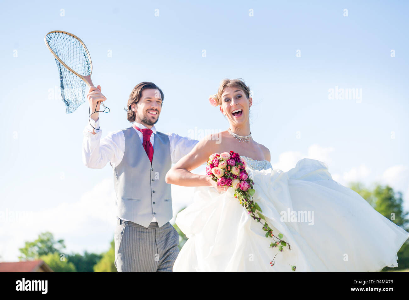 Woman Catching Wedding Bouquet High Resolution Stock Photography and ...