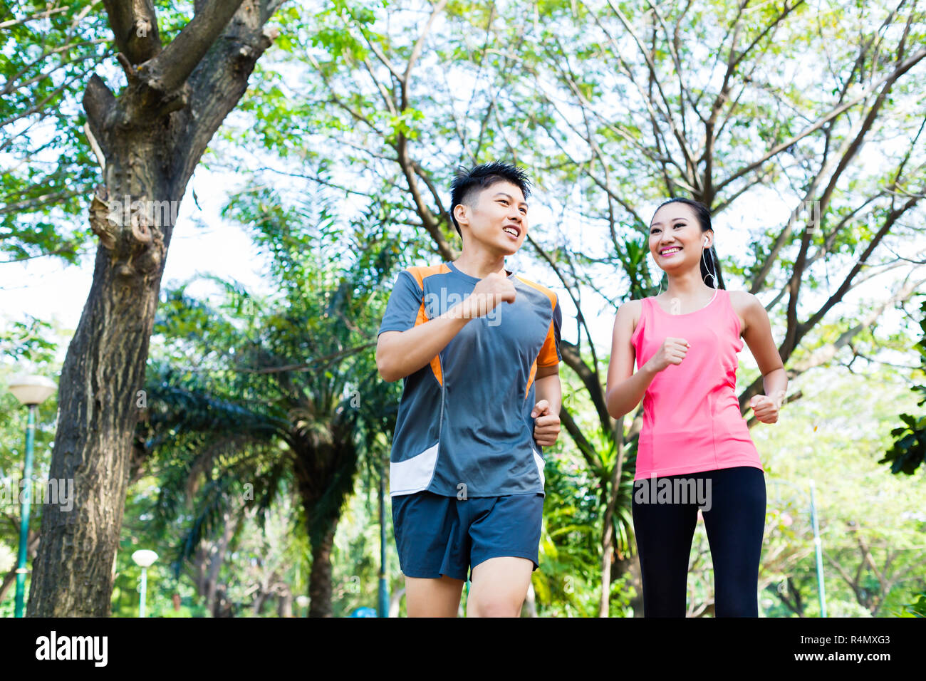 Asian running in town park hi-res stock photography and images - Alamy