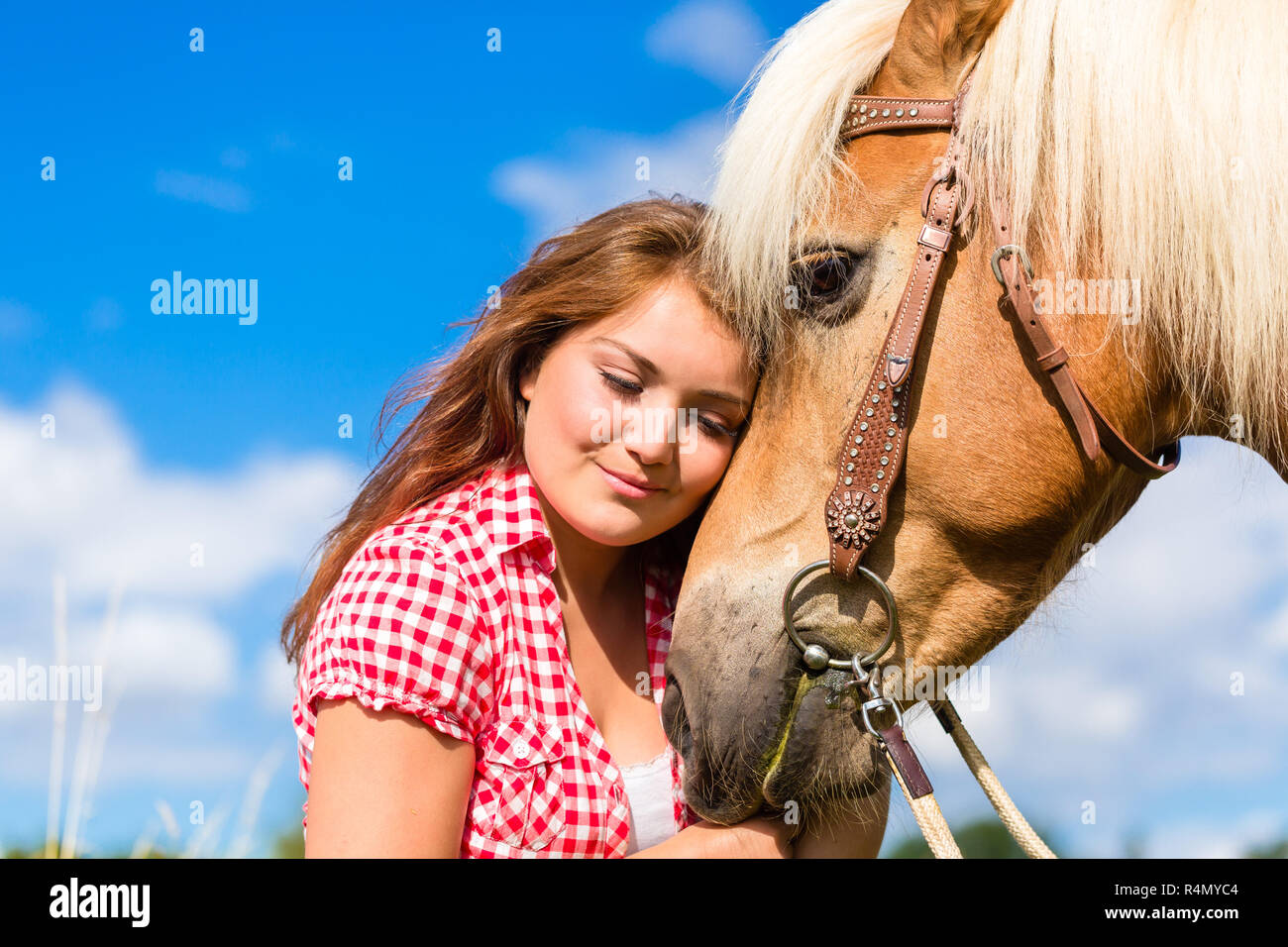 Girl cuddling pony hi-res stock photography and images - Alamy