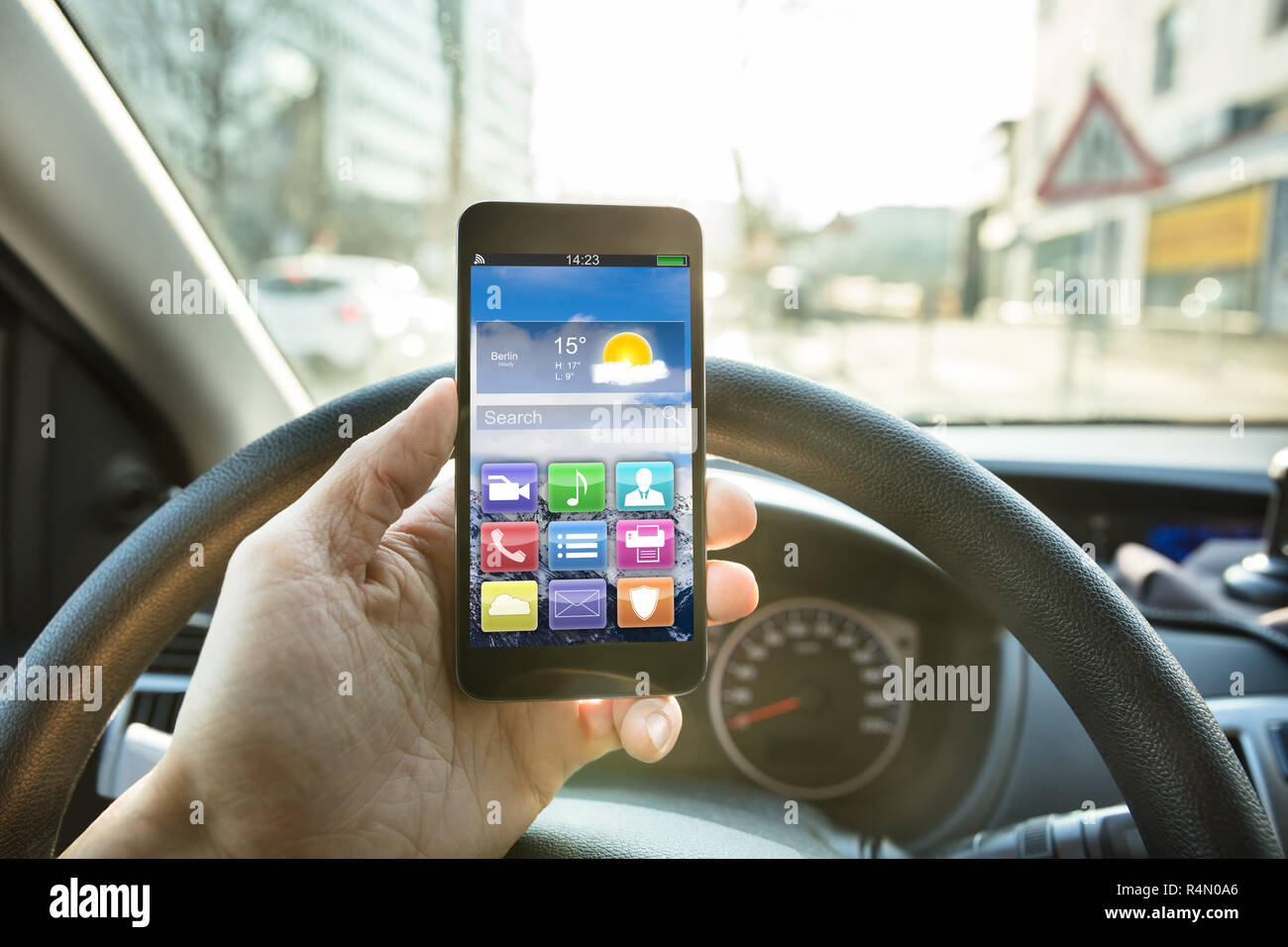 Person Using Mobile Phone While Driving Stock Photo - Alamy