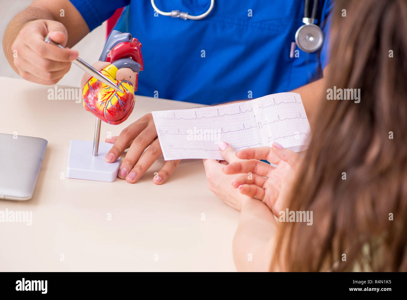 Young patient visiting doctor cardiologist Stock Photo - Alamy
