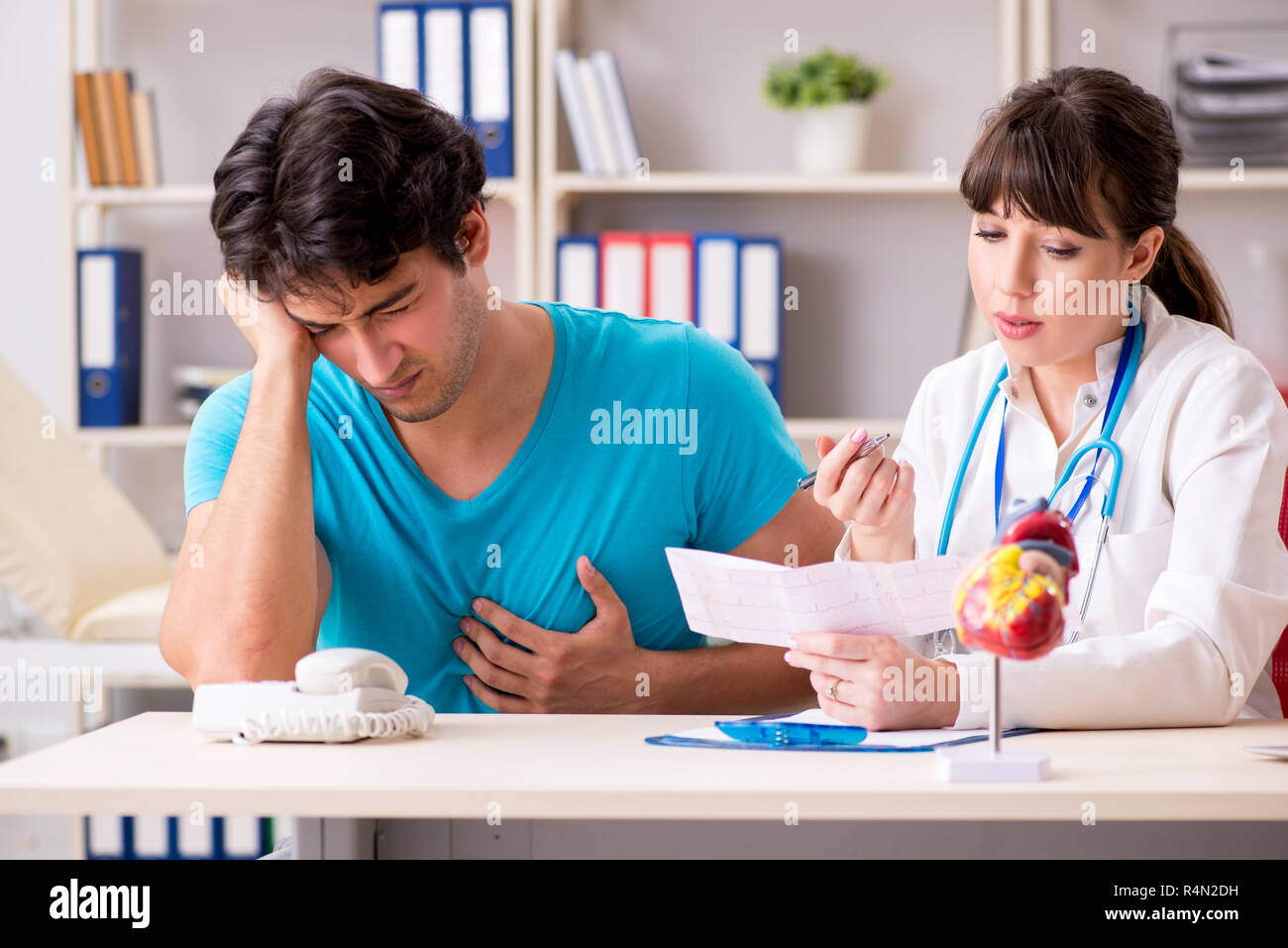 Young patient visiting doctor cardiologist Stock Photo - Alamy