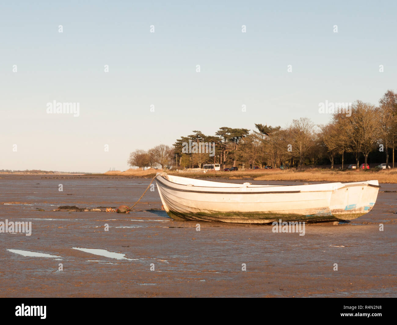 Boat in the mud with the tide out Stock Photo - Alamy
