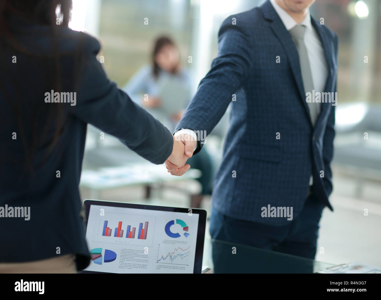 handshake financial partners, on the desktop background, with the ...