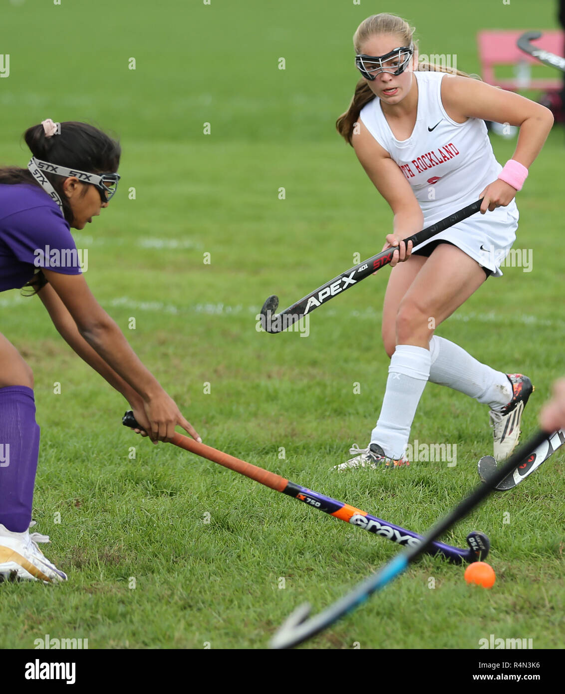 High school girls playing field hockey Stock Photo - Alamy