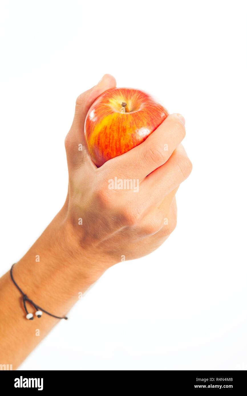 Hand holding an apple Stock Photo - Alamy