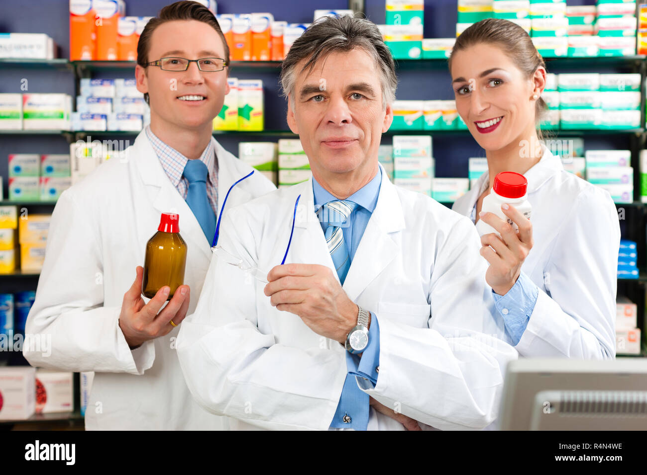 Team of pharmacists in pharmacy Stock Photo - Alamy
